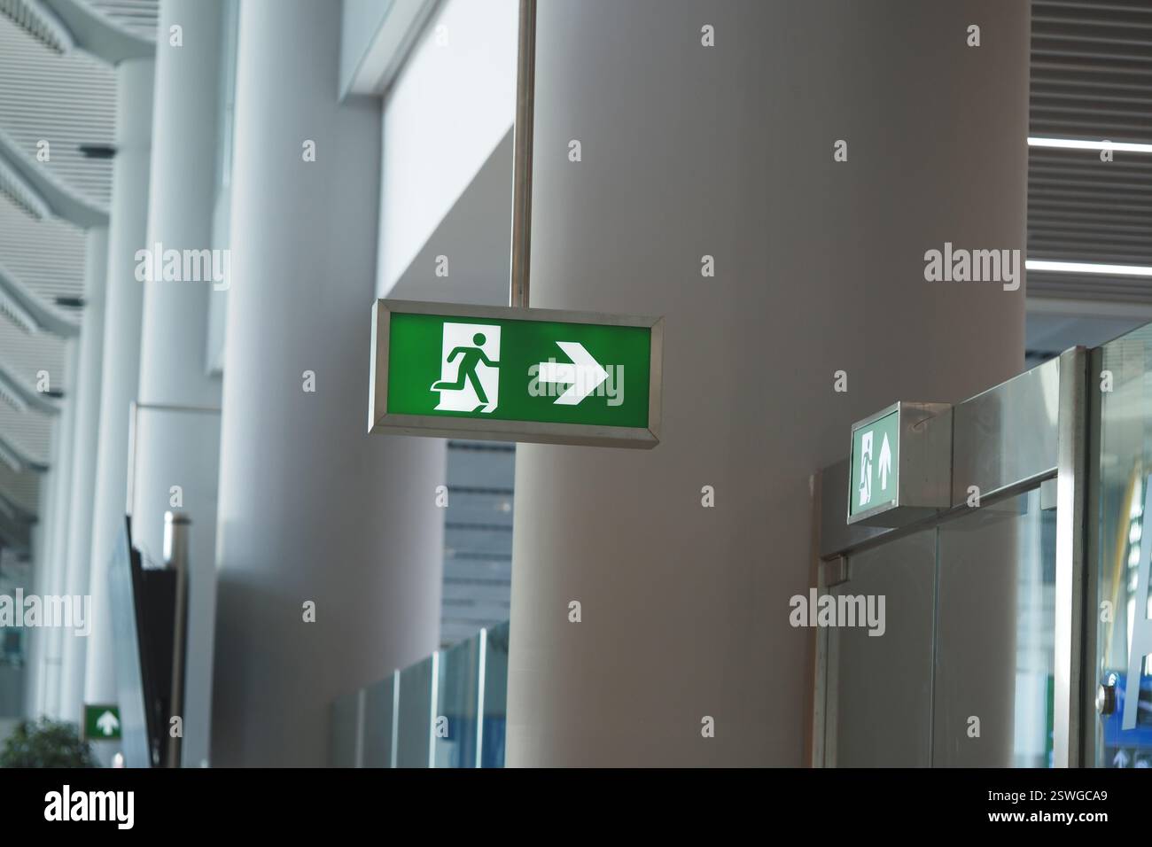 Directional sign for travelers in a modern airport terminal Stock Photo ...