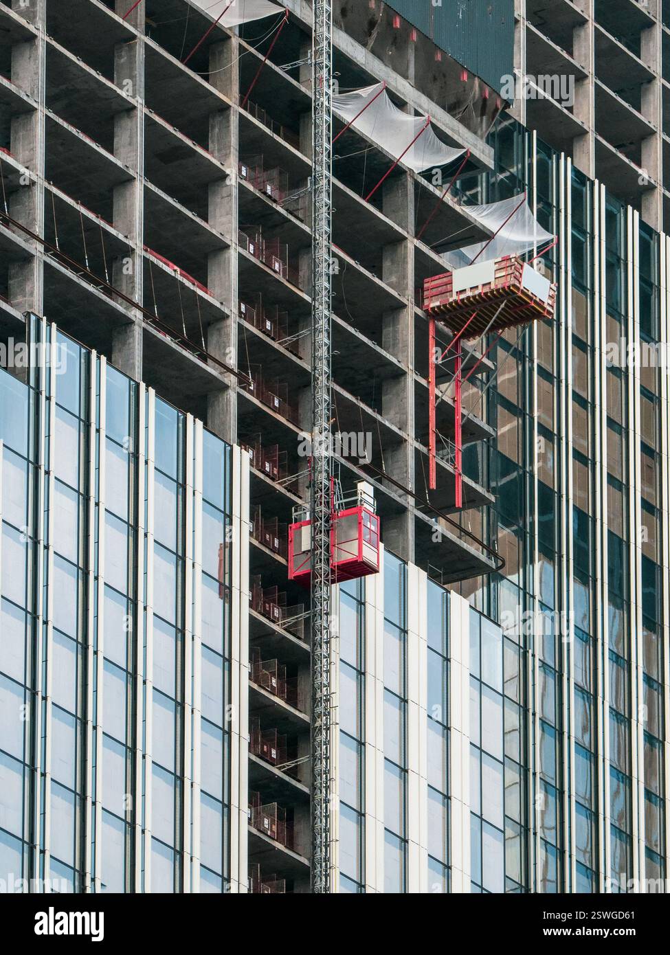 Elevators lifts to the construction sites of a skyscraper under ...