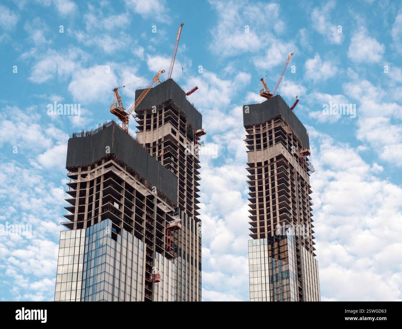 Construction work site and high rise building. Elevators lifts to the ...