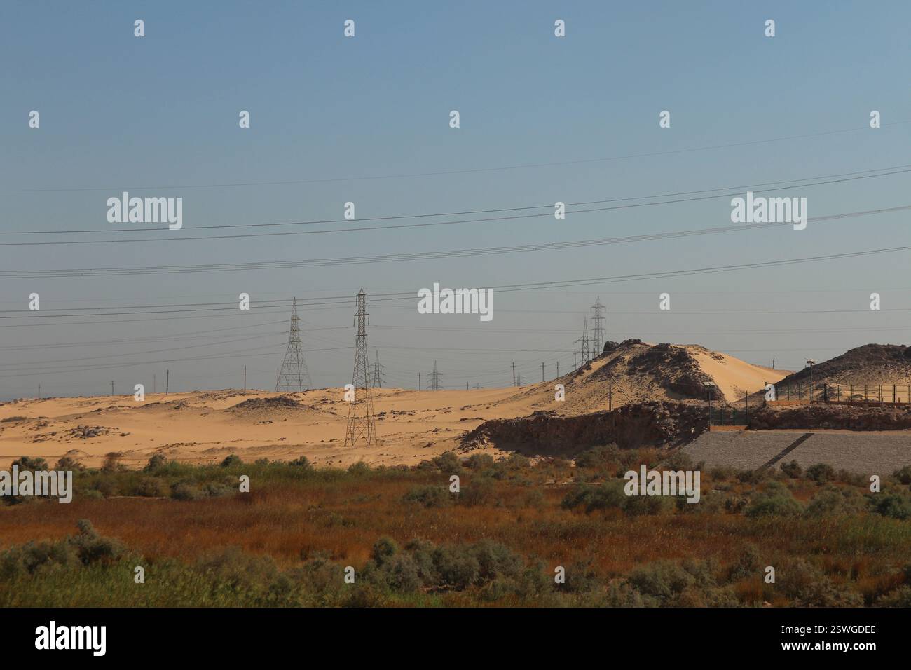 Scenery view of Aswan with transmission towers and desert along the ...