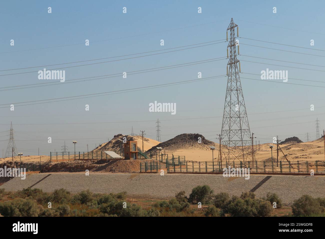 Scenery view of Aswan with transmission towers and desert along the ...