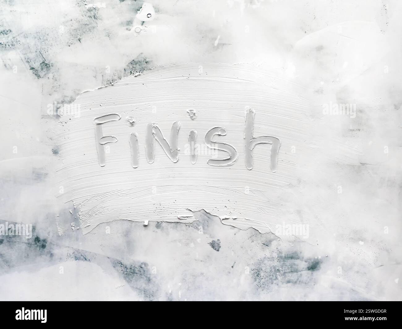 The inscription "finish" on the plaster of the wall. The concept of ...