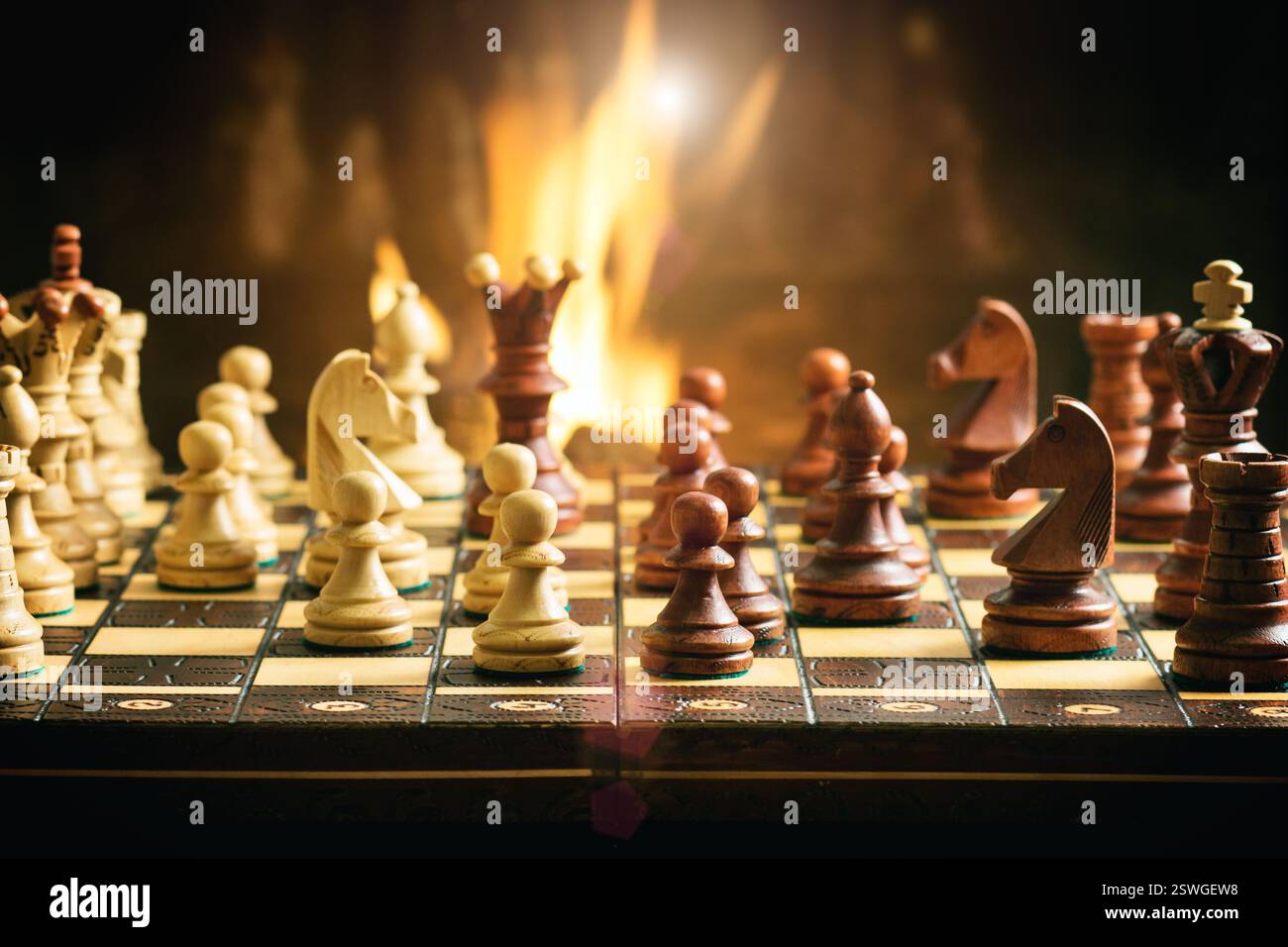 Chess game on the background of a burning fireplace. See series Stock ...