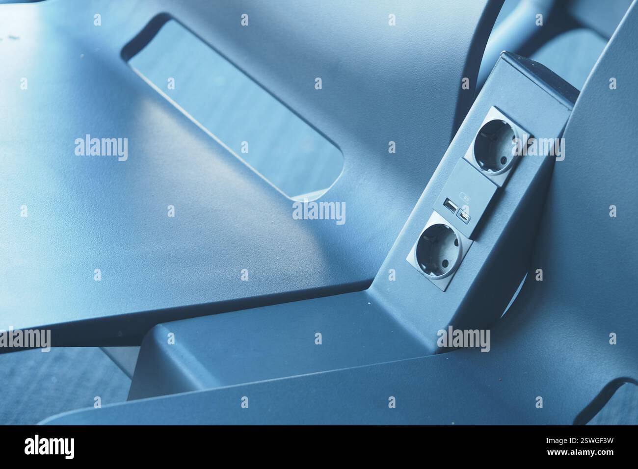 Modern seating with power outlets in a public space Stock Photo - Alamy
