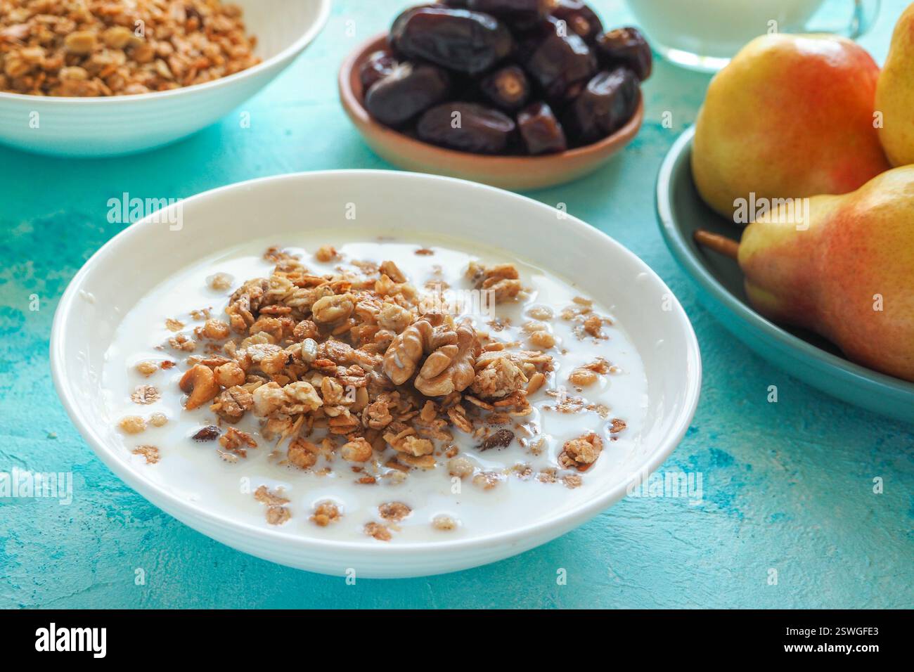 Traditional european breakfast. Milk and granola. Muesli Stock Photo ...
