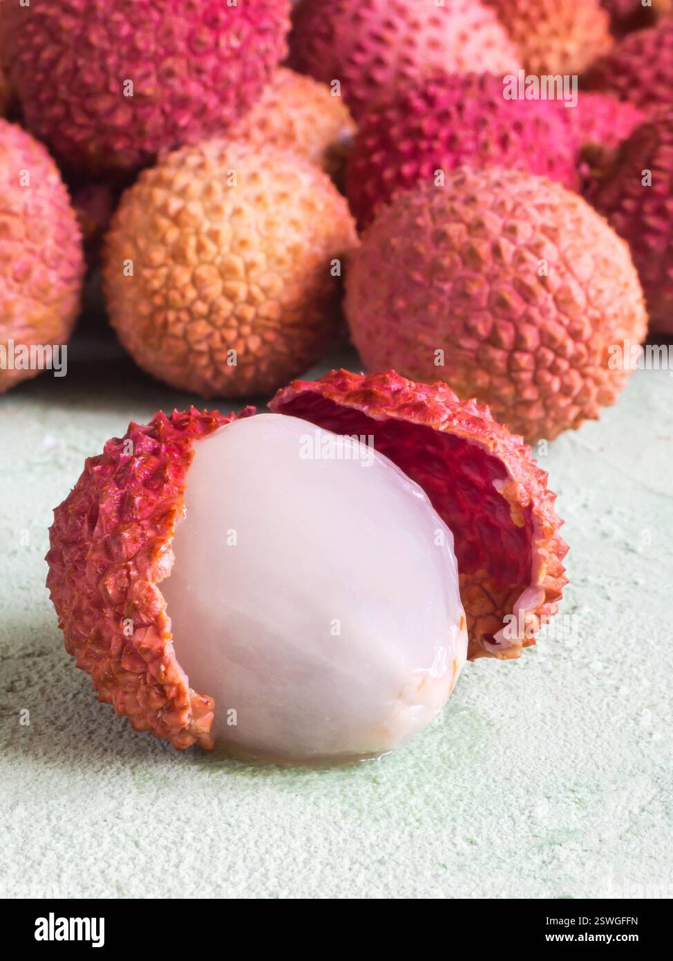 Peeled lychee fruit ripe lychees on a green table hi-res stock ...