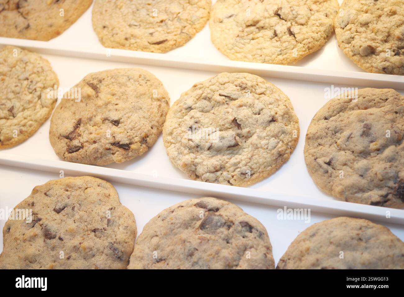 Delicious freshly baked cookies on display in a bakery Stock Photo - Alamy