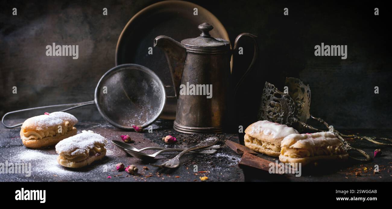 Tea drinking with eclairs and chopped chocolate, served with vintage ...