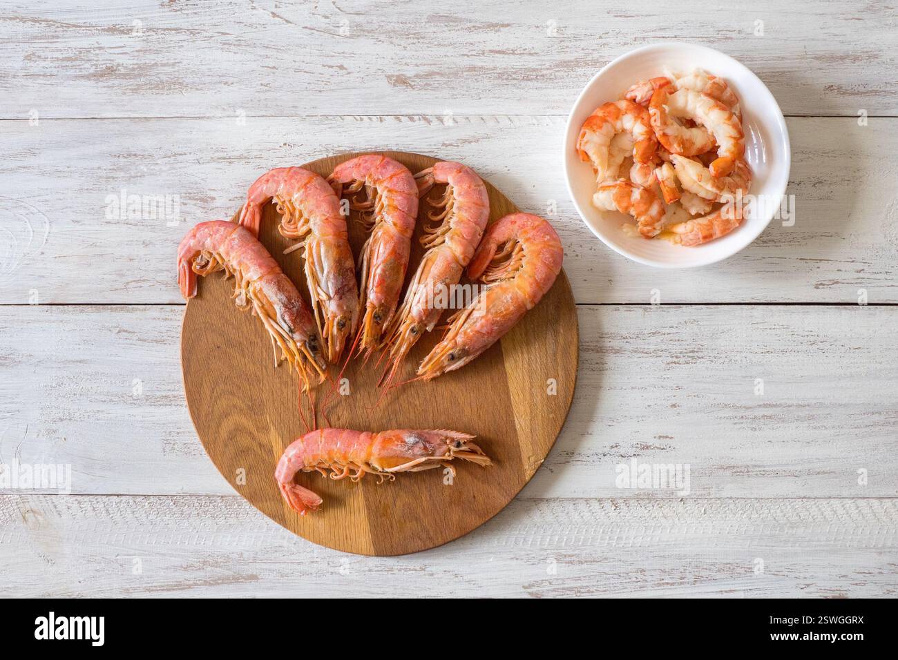 Cooked fresh giant prawns on a wooden chopping board. Top view Stock ...