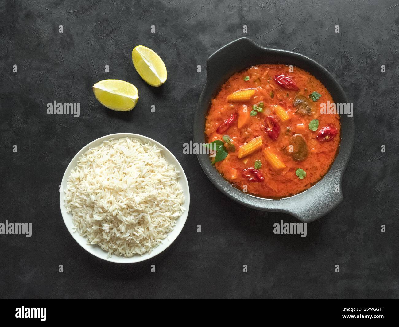 Mixed vegetable Goan curry with basmati rice, Indian food. Top view ...