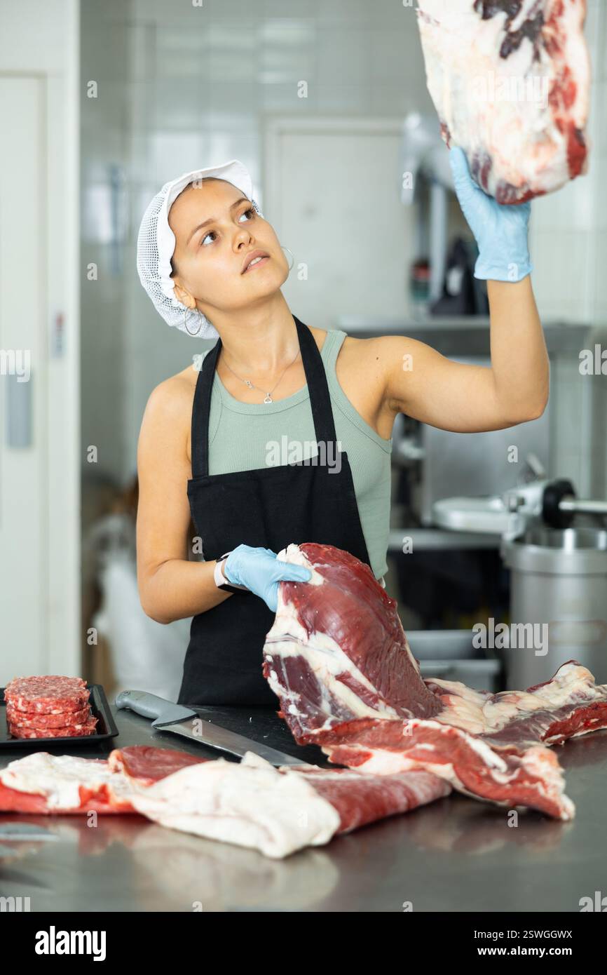 Female butcher slicing beef hi-res stock photography and images - Alamy