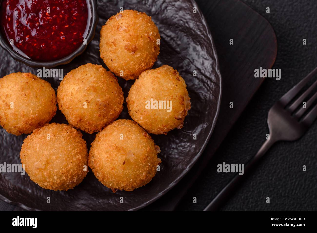 Crispy French fries with mozzarella cheese with raspberry sauce Stock ...
