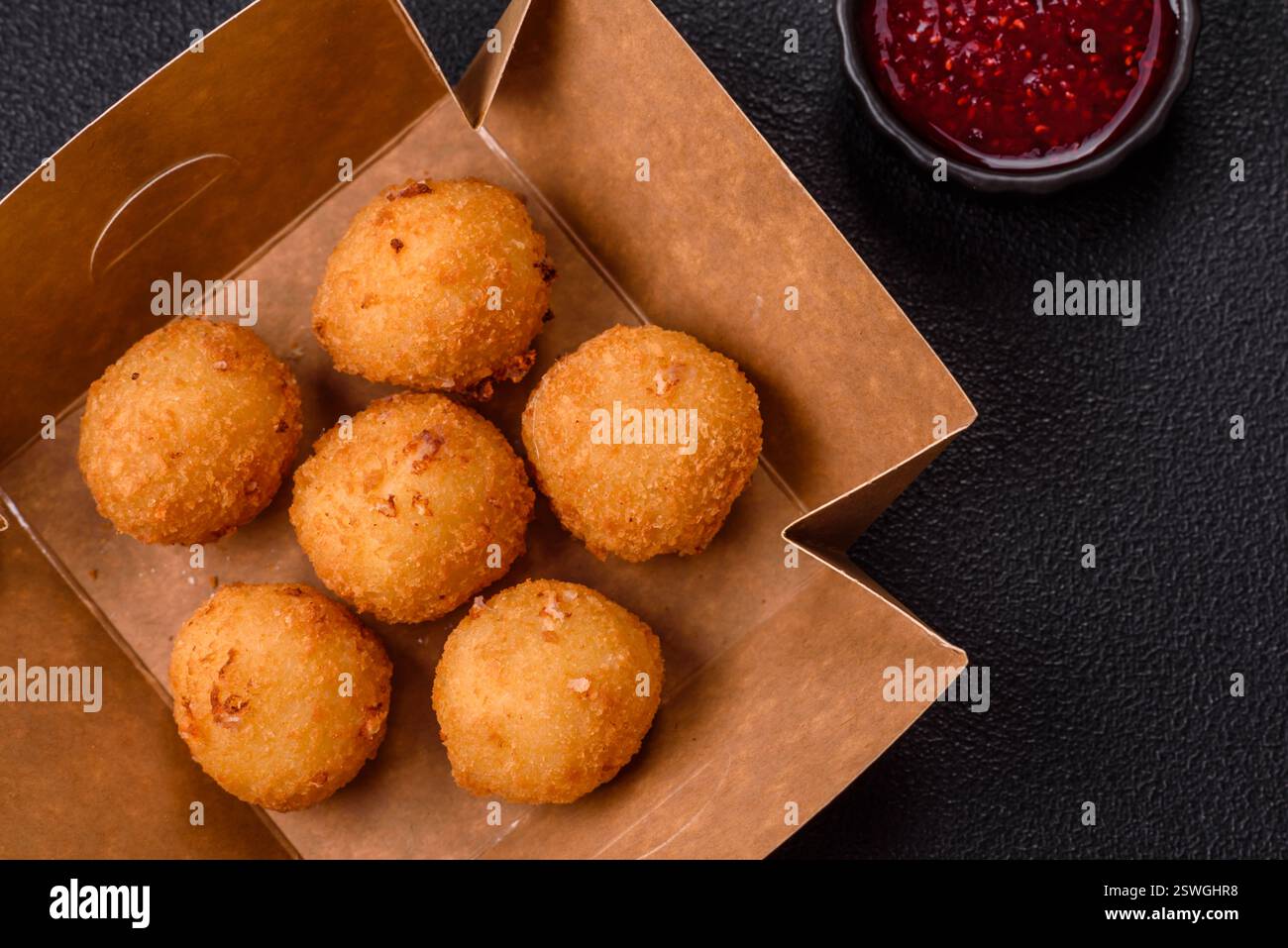 Crispy French fries with mozzarella cheese with raspberry sauce Stock ...