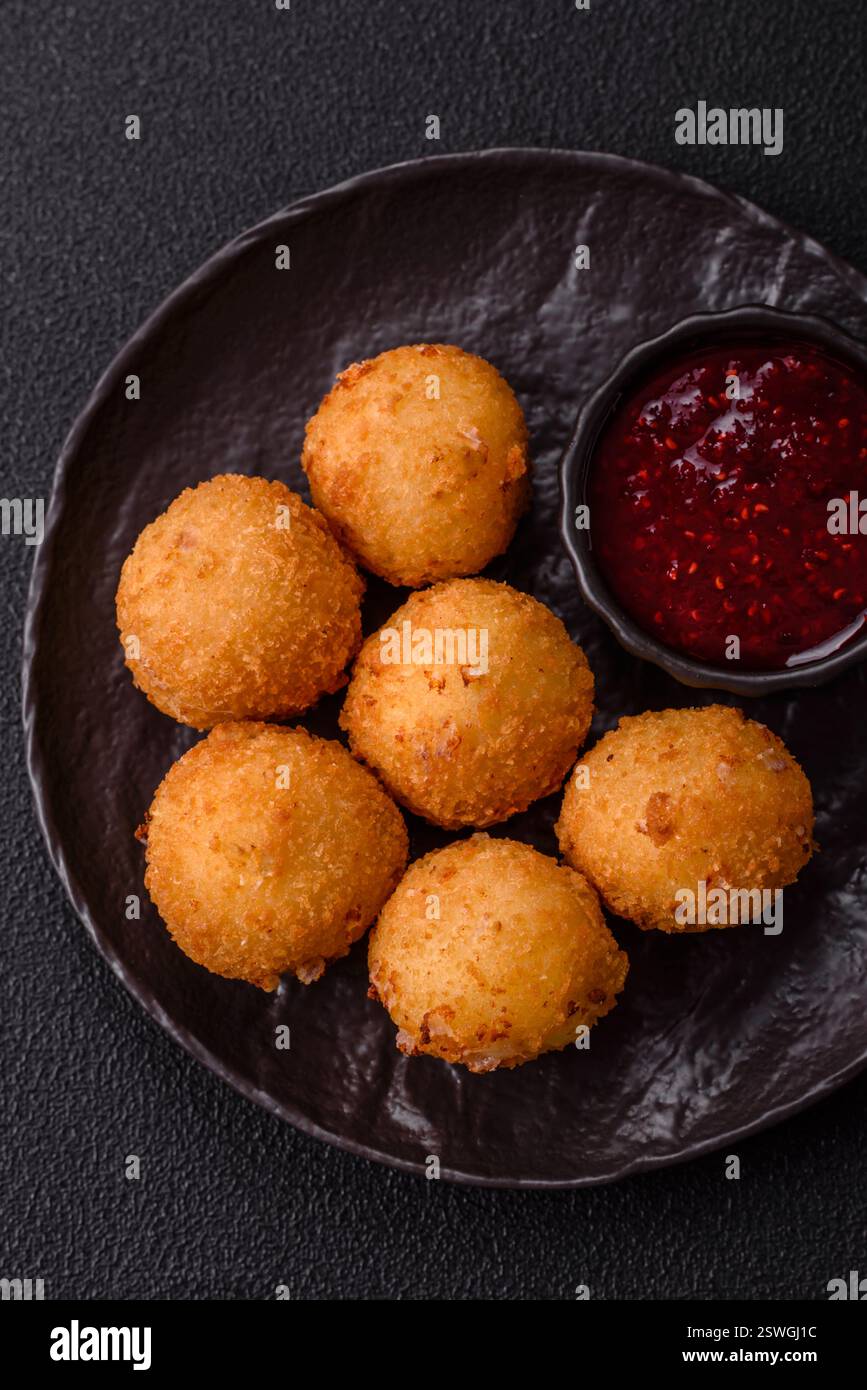 Crispy French fries with camembert or mozzarella cheese with cranberry ...