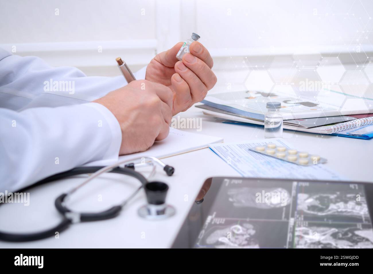 A healthcare provider is taking notes and reviewing medication while ...