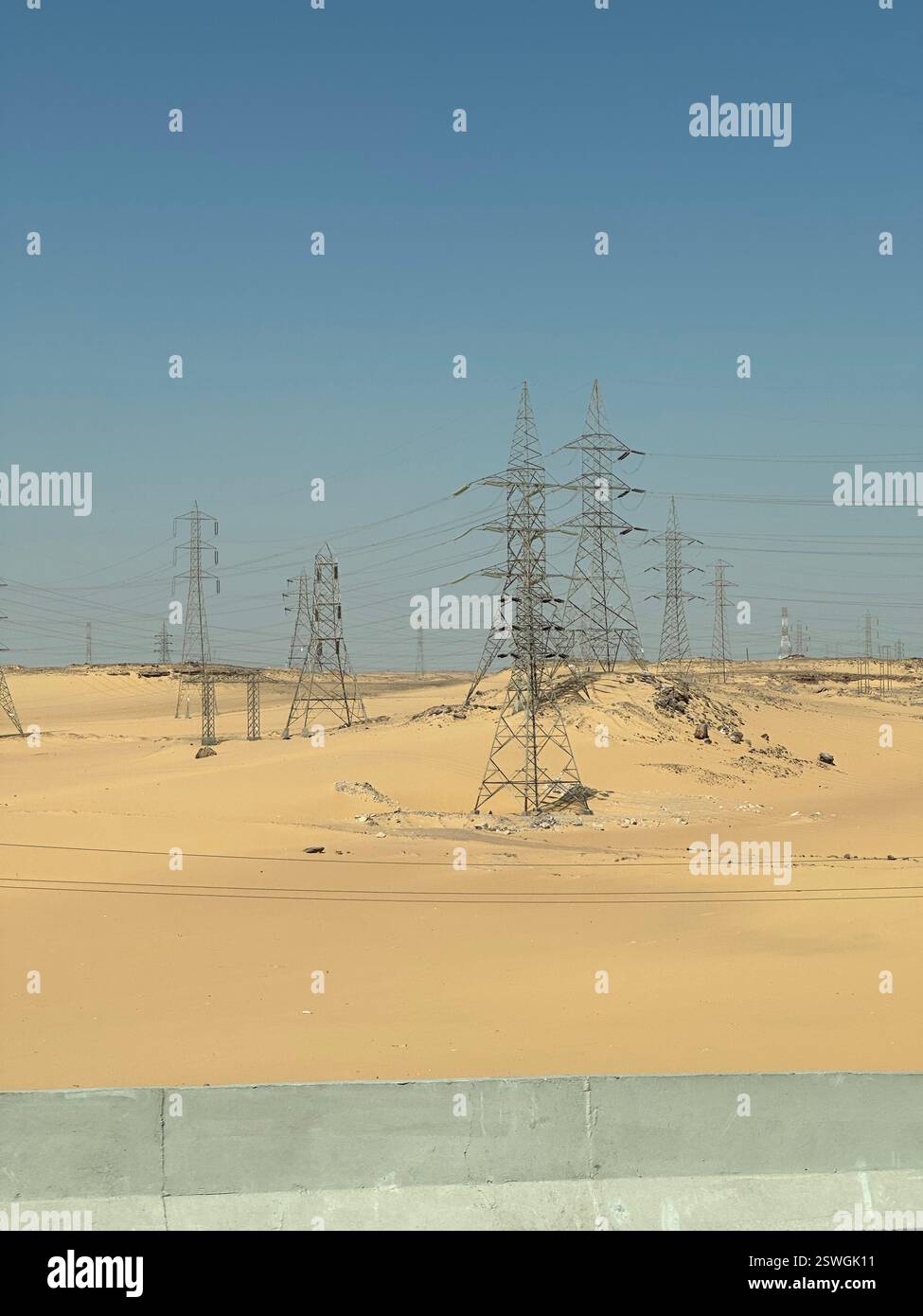 Scenery view of Aswan with transmission towers and desert along the ...