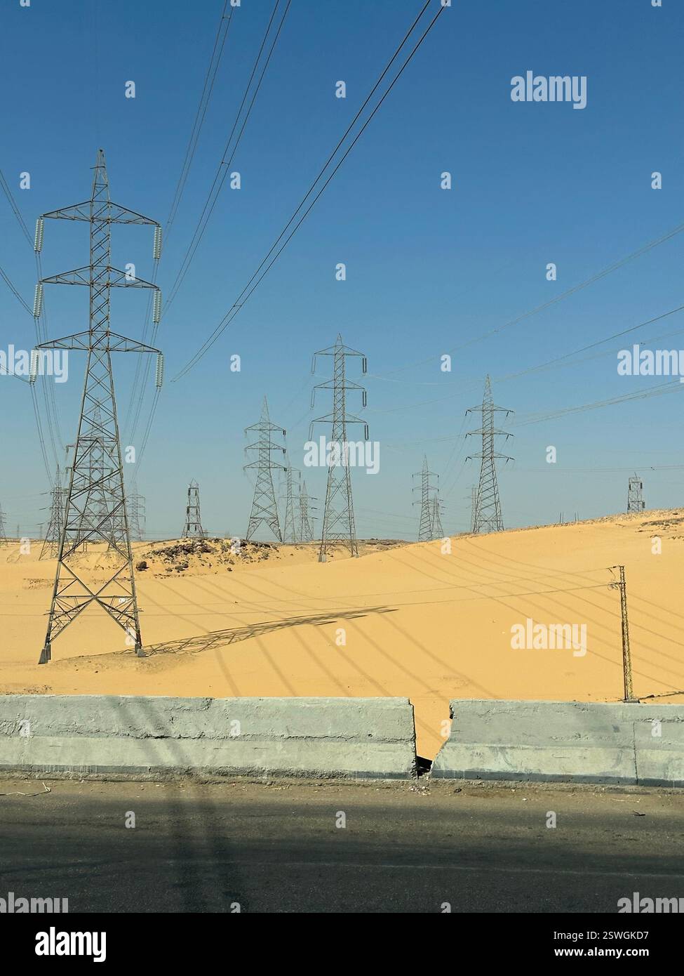Scenery view of Aswan with transmission towers and desert along the ...