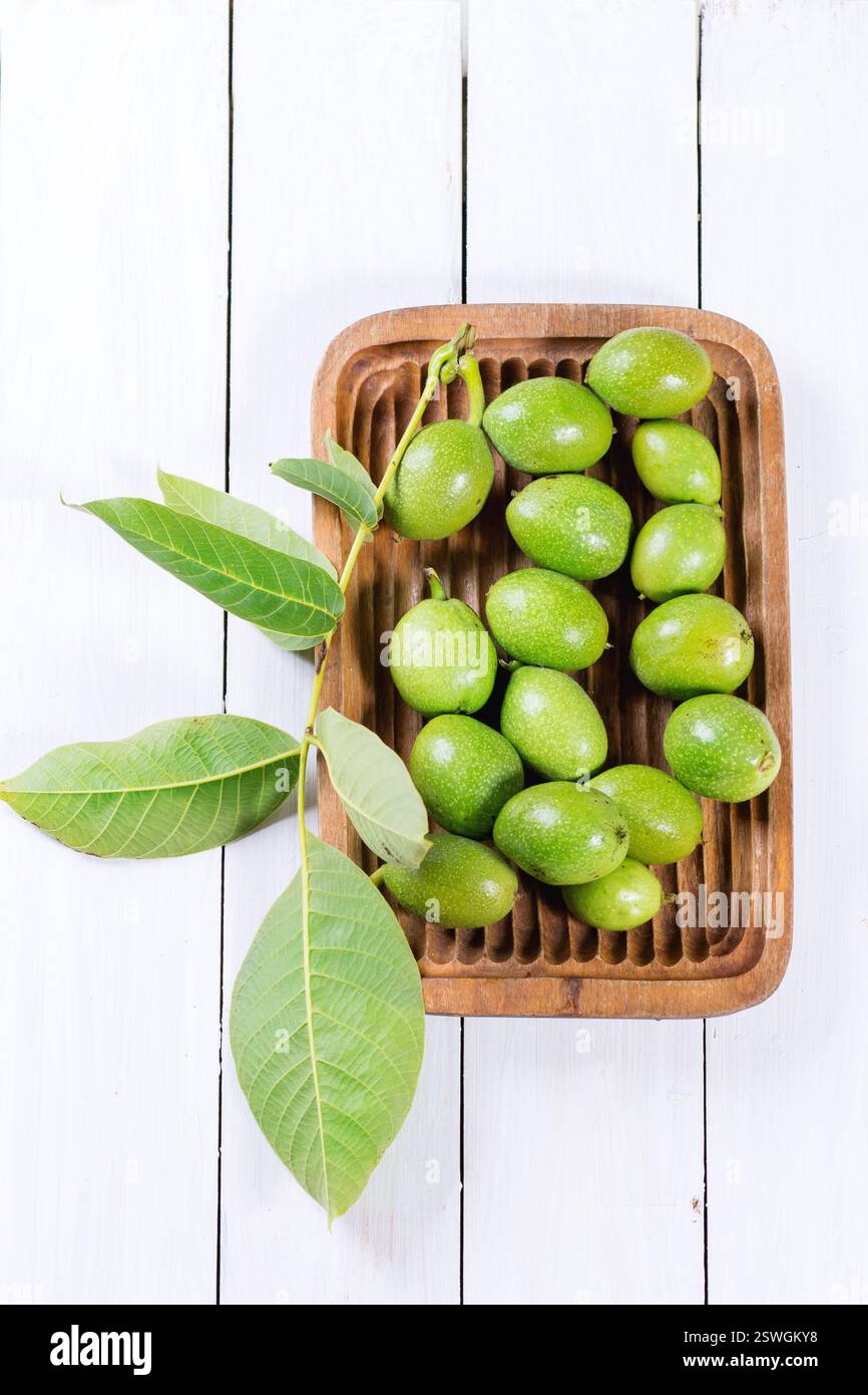 Young green walnuts Stock Photo - Alamy
