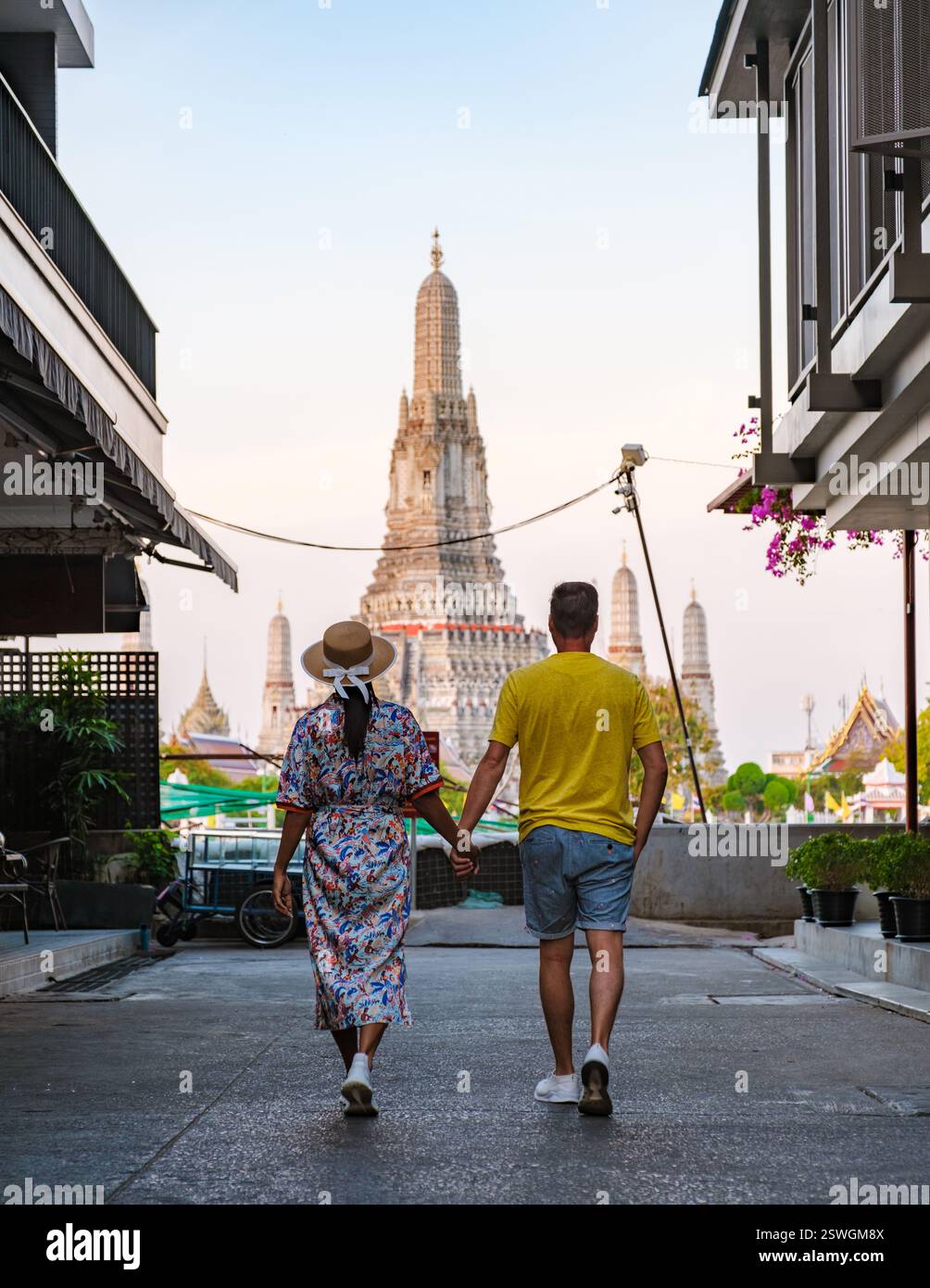 Couple Strolling Hand in Hand Towards Wat Arun in Bangkok, Thailand at ...