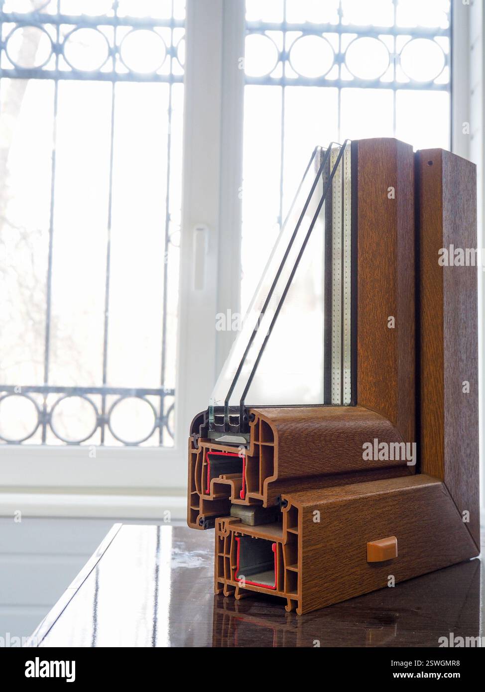 A cross section of wood effect triple glazing cut away to show the ...