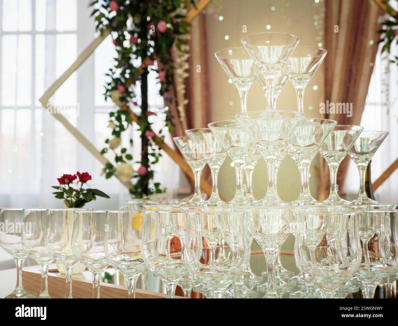 Close up of empty wine glasses on a table are a pyramid. Beautiful ...