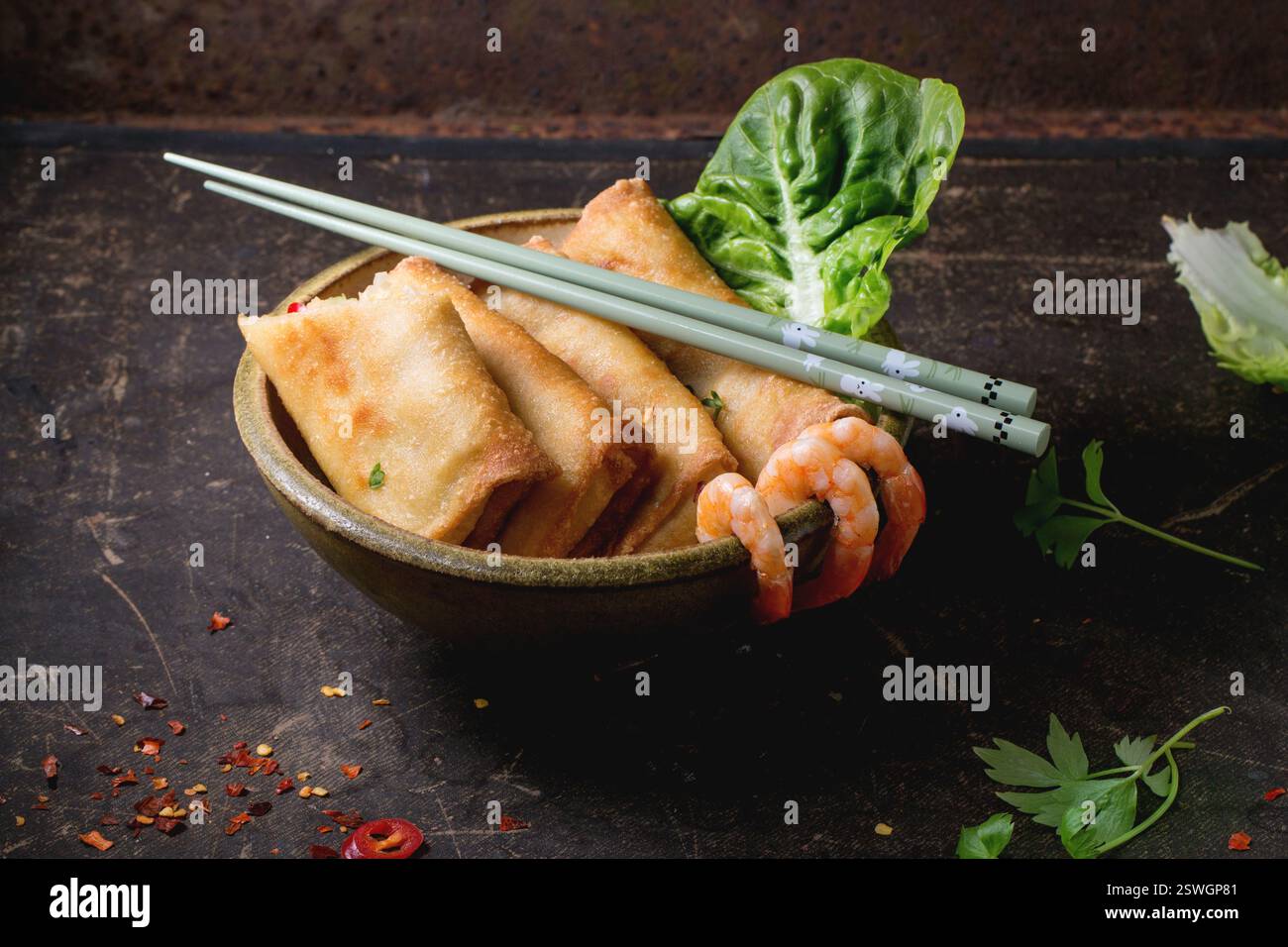 Fried spring rolls with vegetables and shrimps, served in ceramic bowl ...