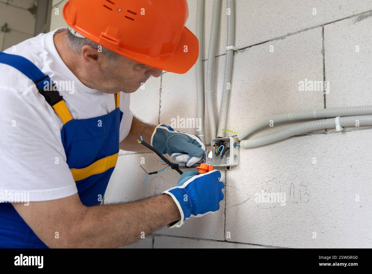 Builder electrician electrical engineer working to connect all the ...