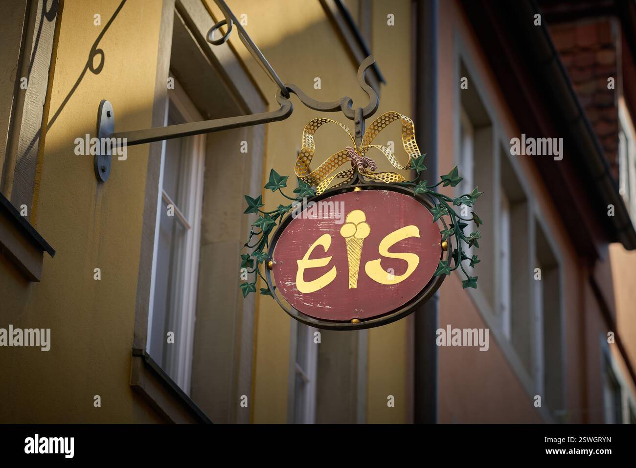 Sign with the German inscription Eis in the old town of Rothenburg ob ...
