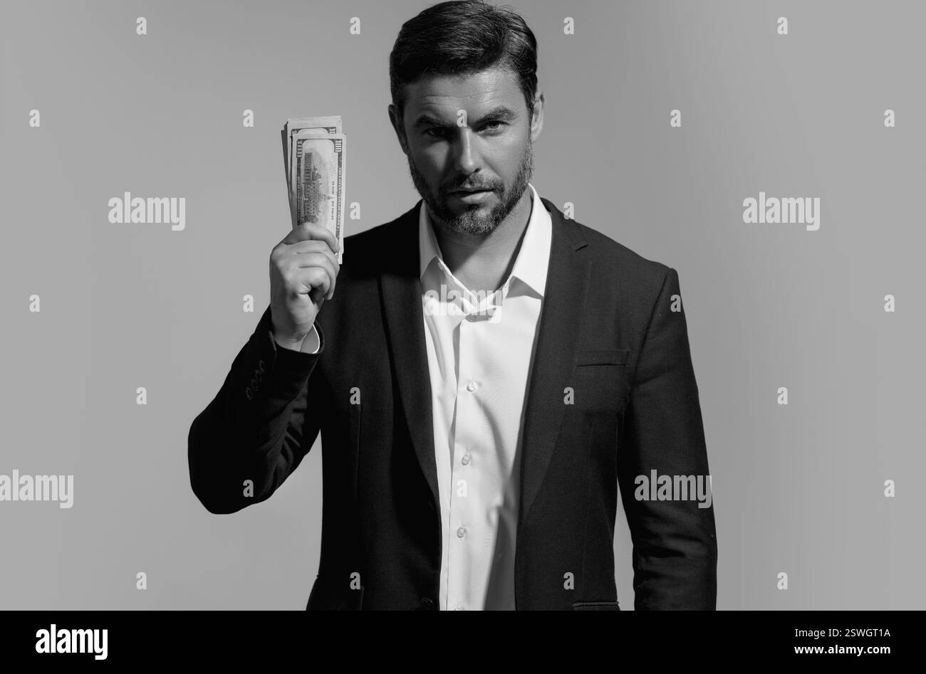 Man with money cash. Dollar banknotes. Portrait of man holding bunch of ...