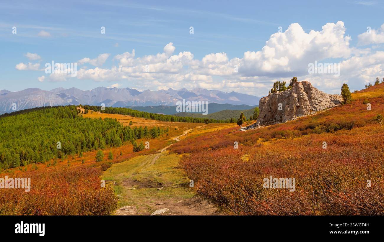 Panoramic view of broken dirt road through the summer plateau. Awesome ...