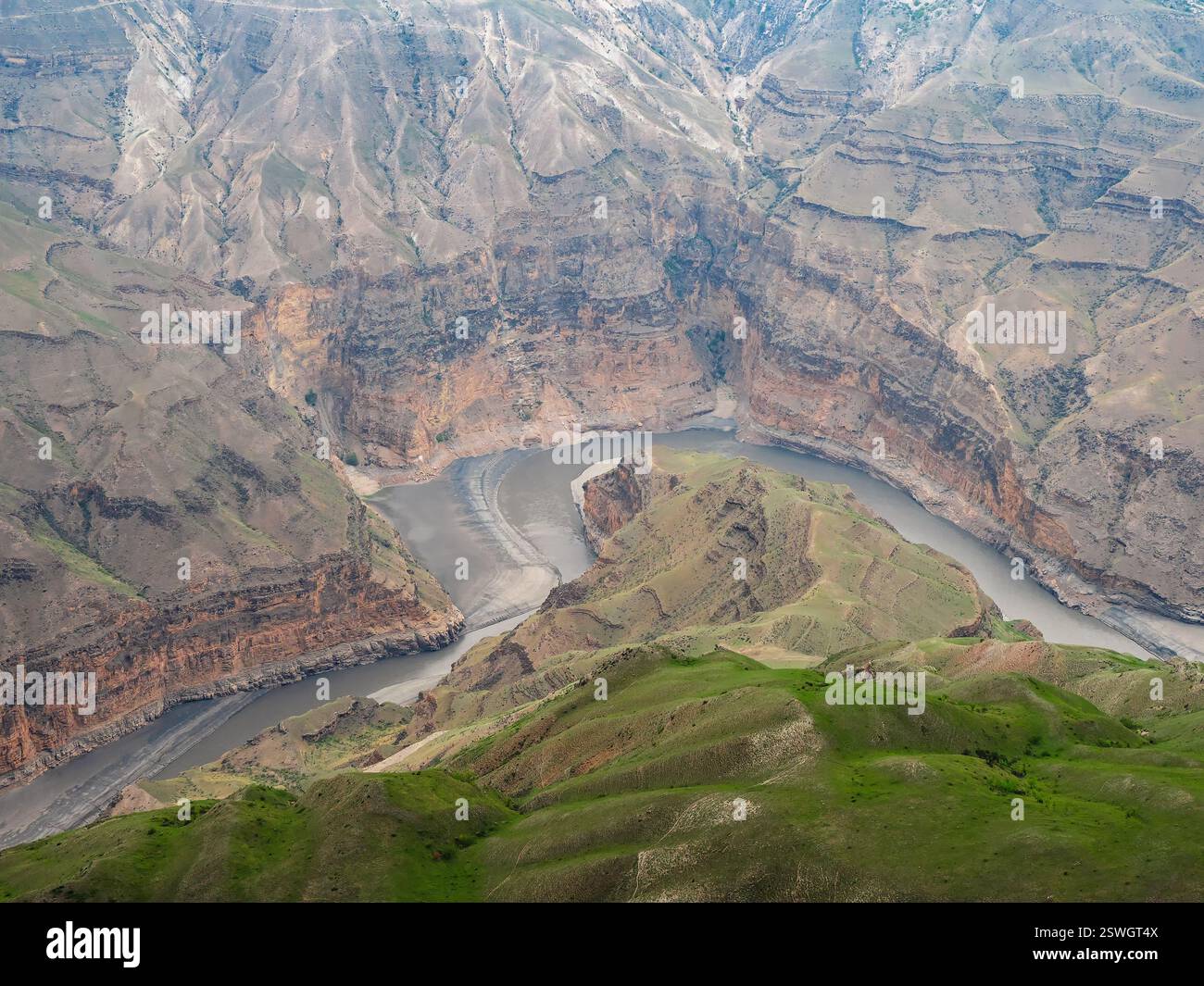 Deep canyon, geological terrain. Winding river at the bottom of the ...
