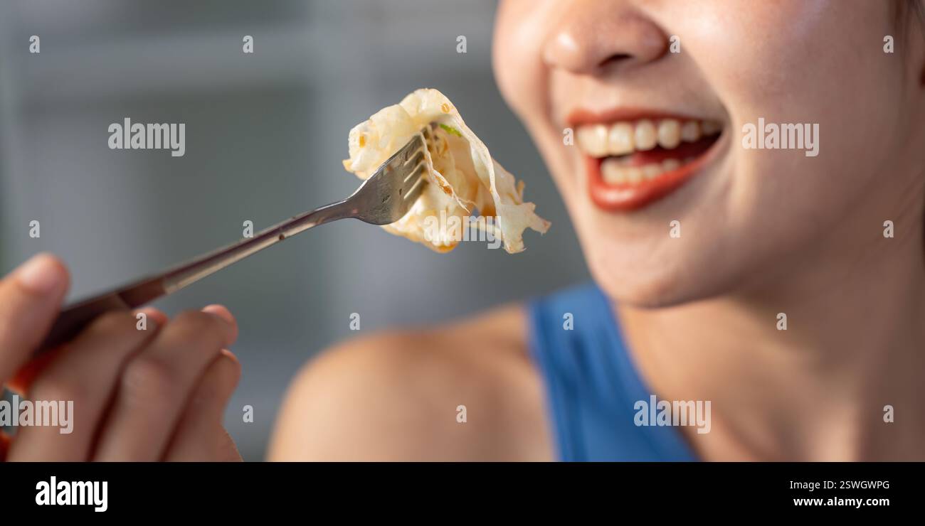 Smiling woman enjoying healthy meal, promoting wellness and positive ...