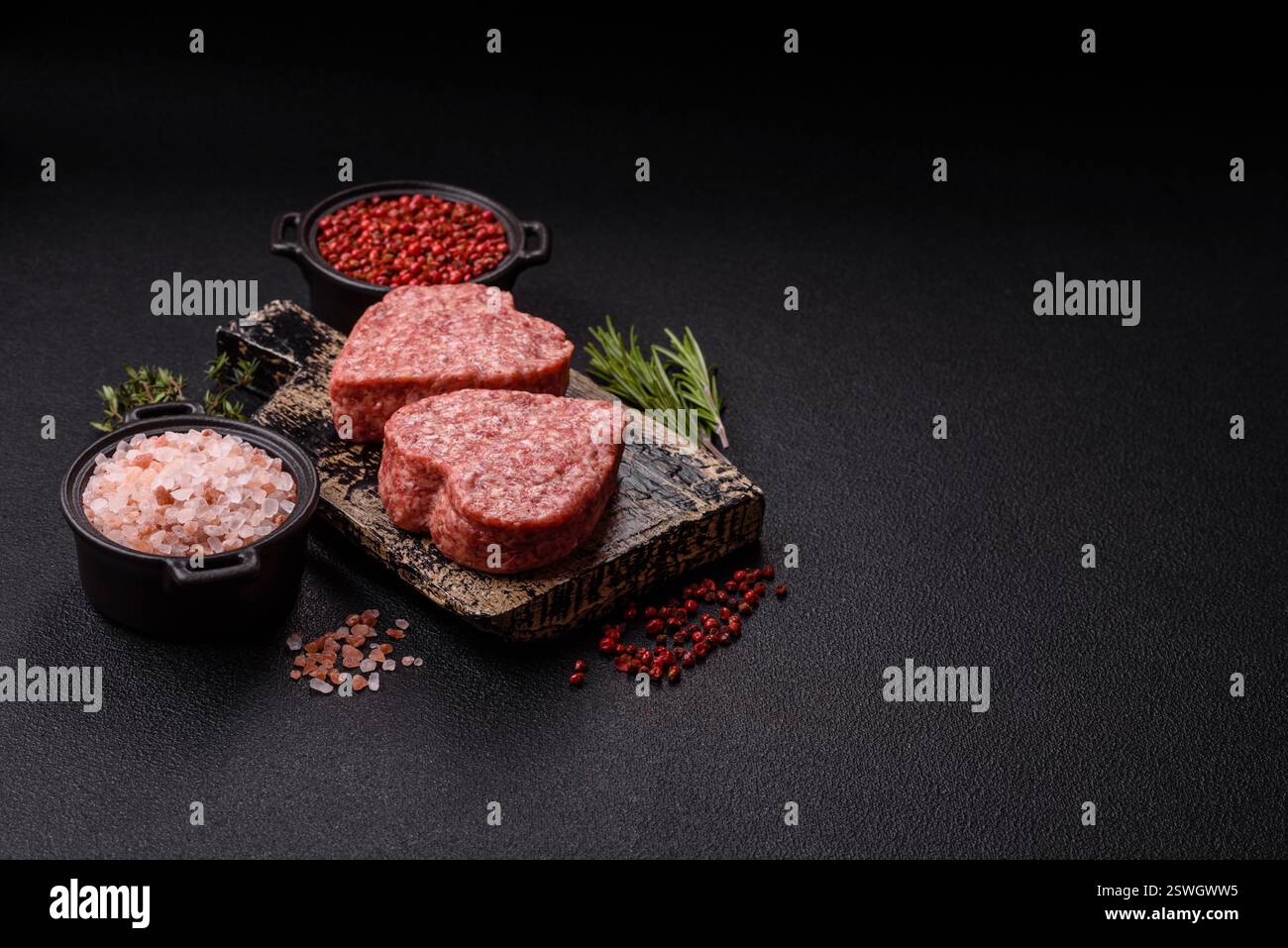 Raw beef or pork burger patty in the shape of a heart Stock Photo - Alamy