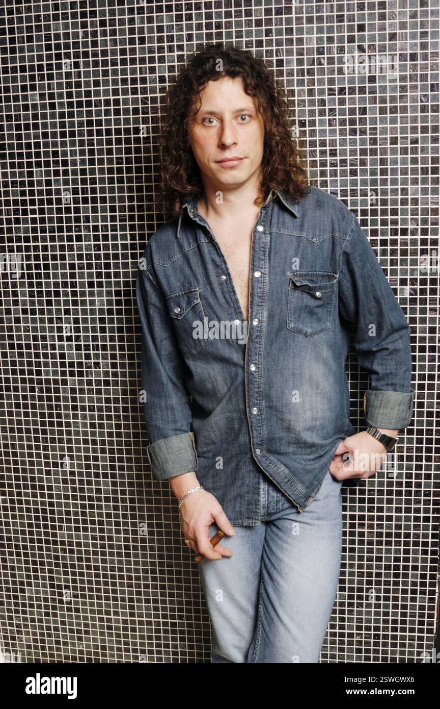 Stereophonics drummer Stuart Cable posing with a cigar backstage at the ...