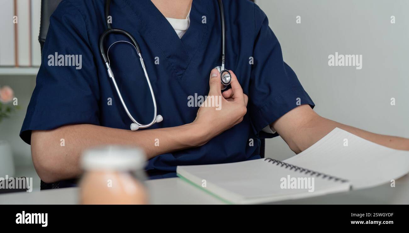 Medical student checking vital signs with a stethoscope while studying ...