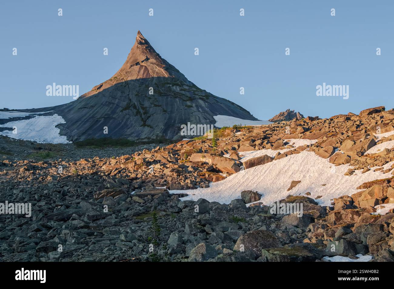 Steep eroded rough mountain peak Stock Photo - Alamy