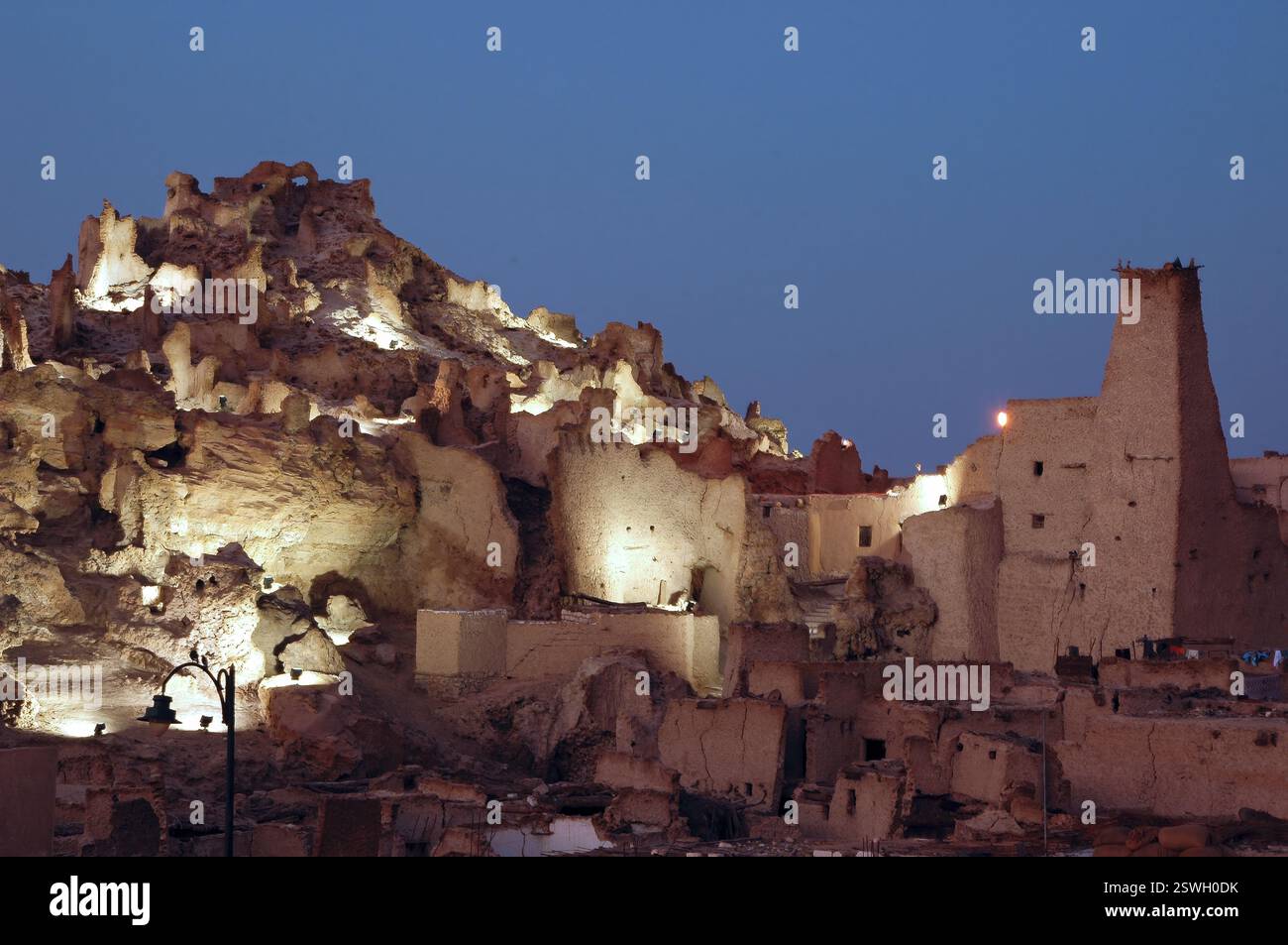 View at twilight of mud brick deserted houses at the ancient fortress ...