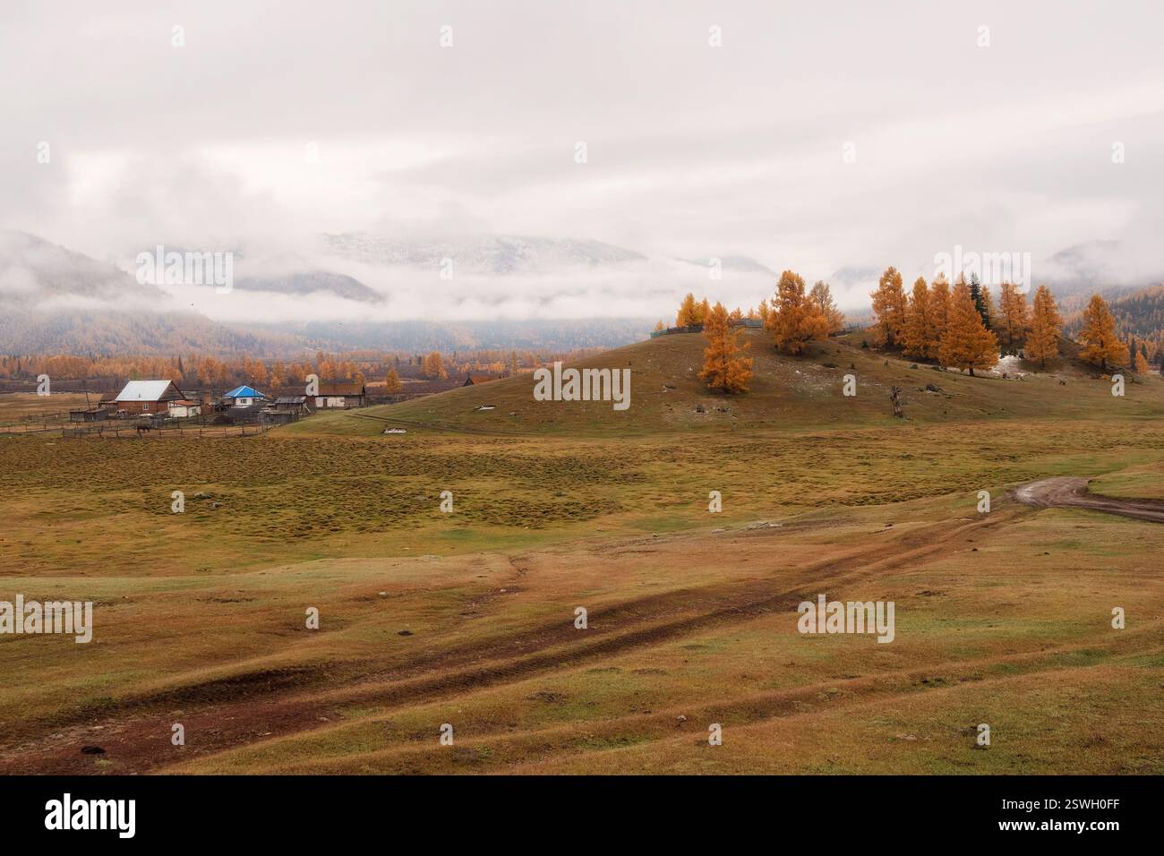 Russian hinterland, a distant village in autumn. Beautiful mountains ...