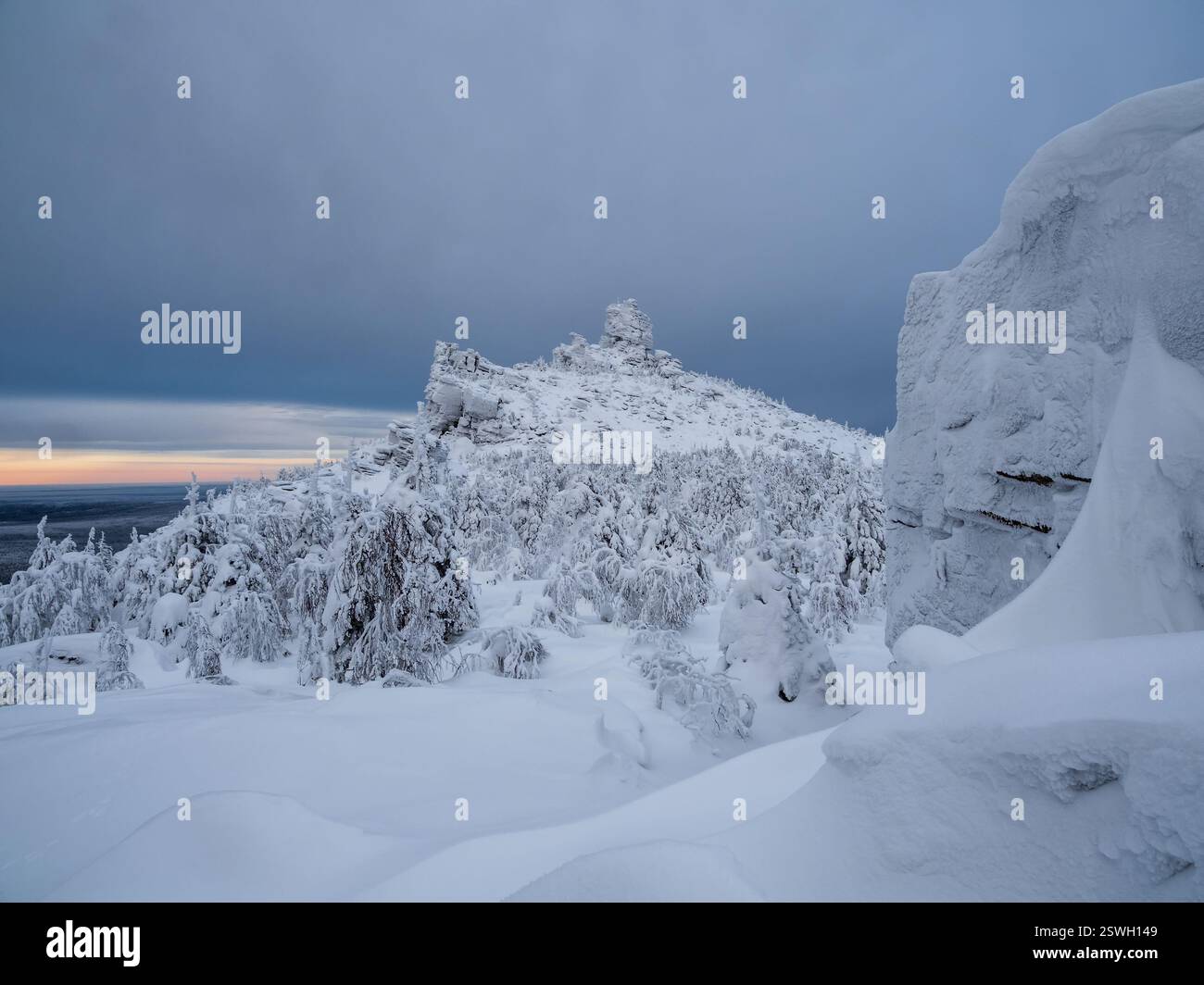 Stone pillars of weathering in winter. Landscape of plateau with snow ...