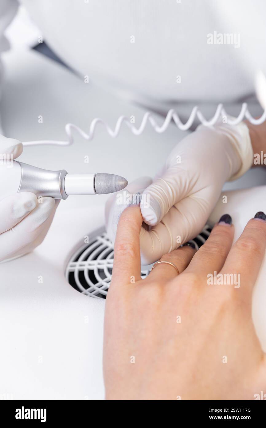 nail processing with electric file Stock Photo - Alamy