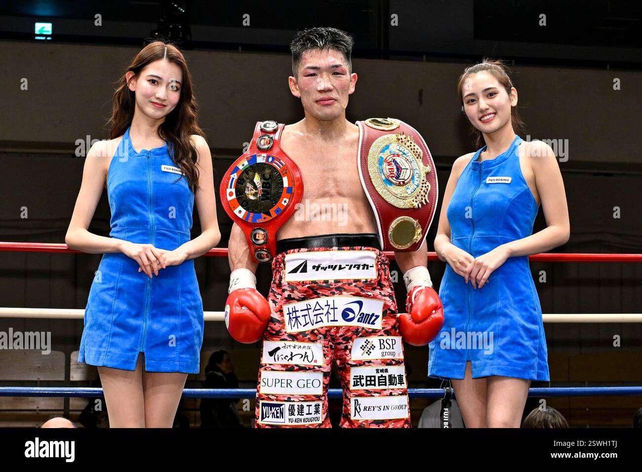 Champion Daishi Nagata poses with his championship belts after winning his OPBF and WBO Asia ...