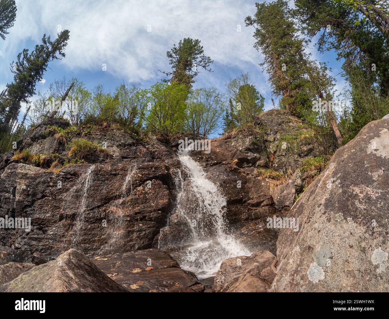 Waterfall on the mountain. Beautiful summer mountain waterfall. Nature ...