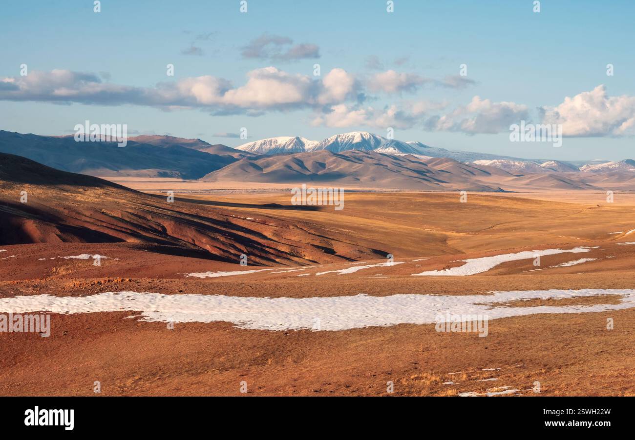 Snow-capped mountain peaks and golden autumn steppe Stock Photo - Alamy