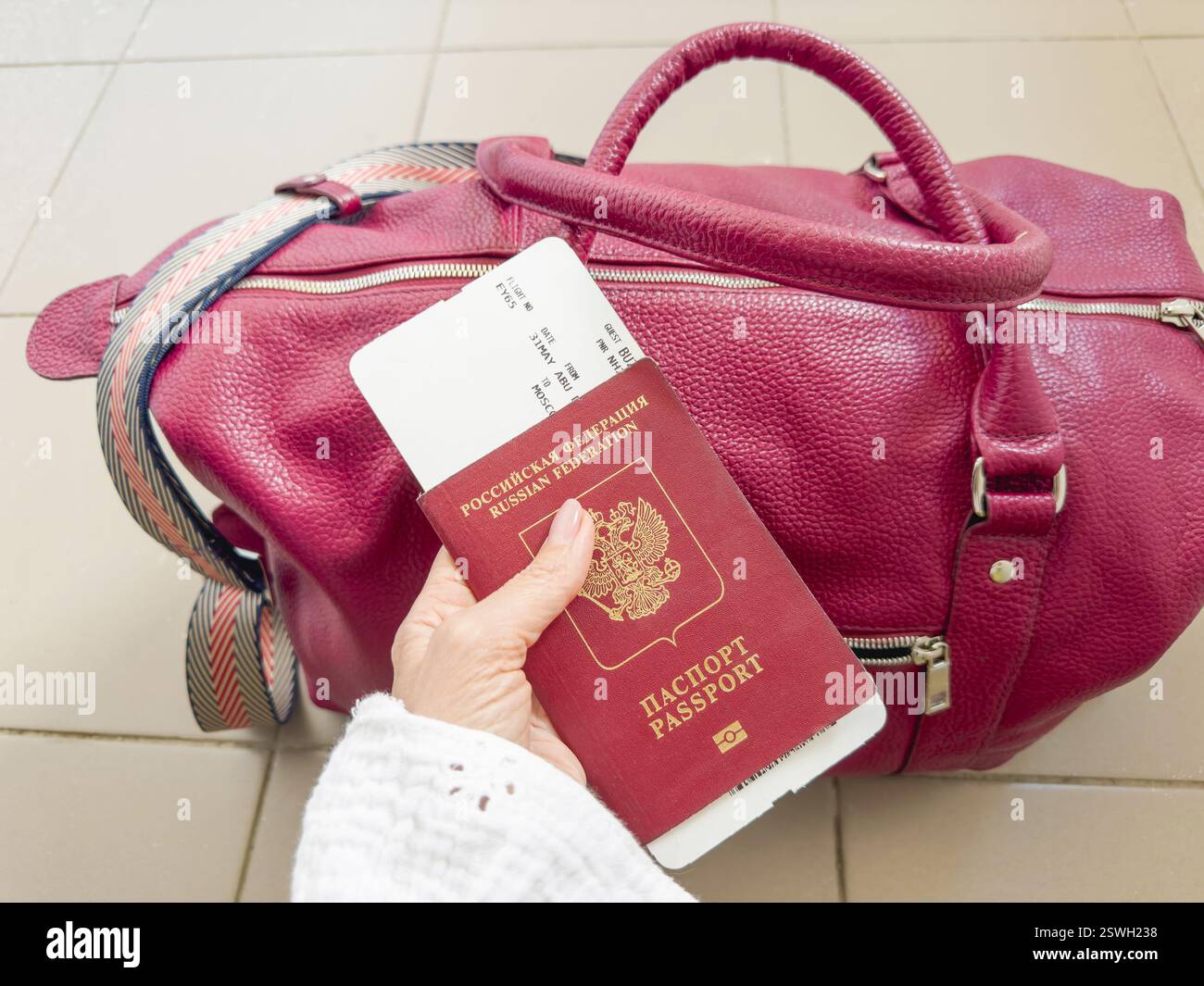 Russian red passport and boarding pass in a woman hand Stock Photo - Alamy