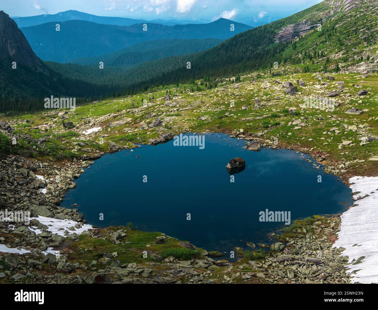 Mountains of Sayan ridge with rocks, lake, pine trees at summer Stock ...