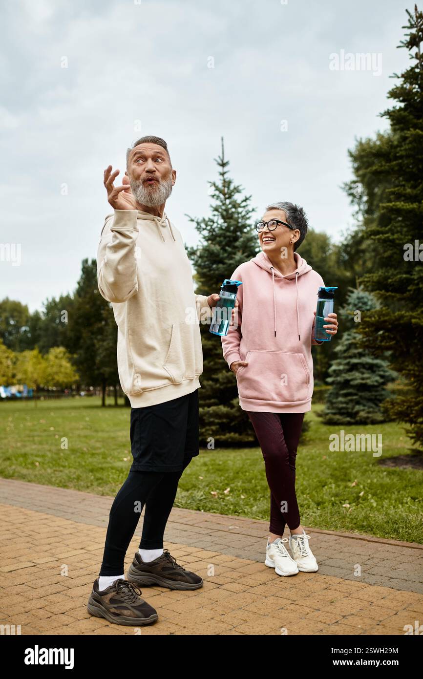 A loving couple strolls through a serene park, sharing smiles and ...