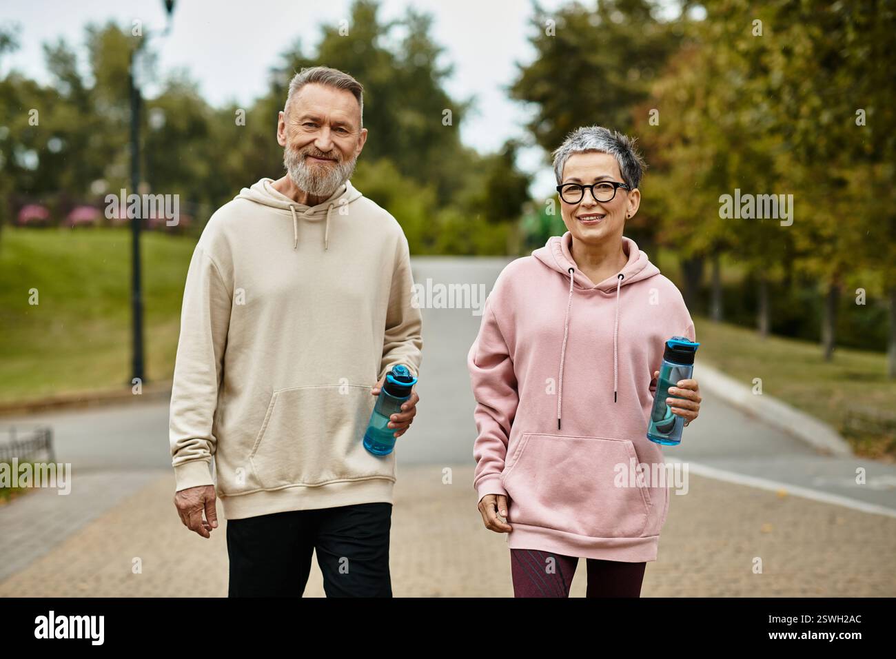 A mature couple enjoying a peaceful stroll together, embracing love and ...
