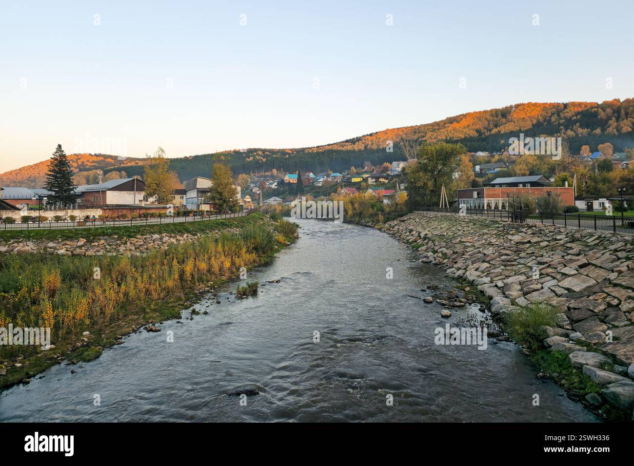 Evening village on the banks of a mountain river. Gorno-Altaisk. The ...