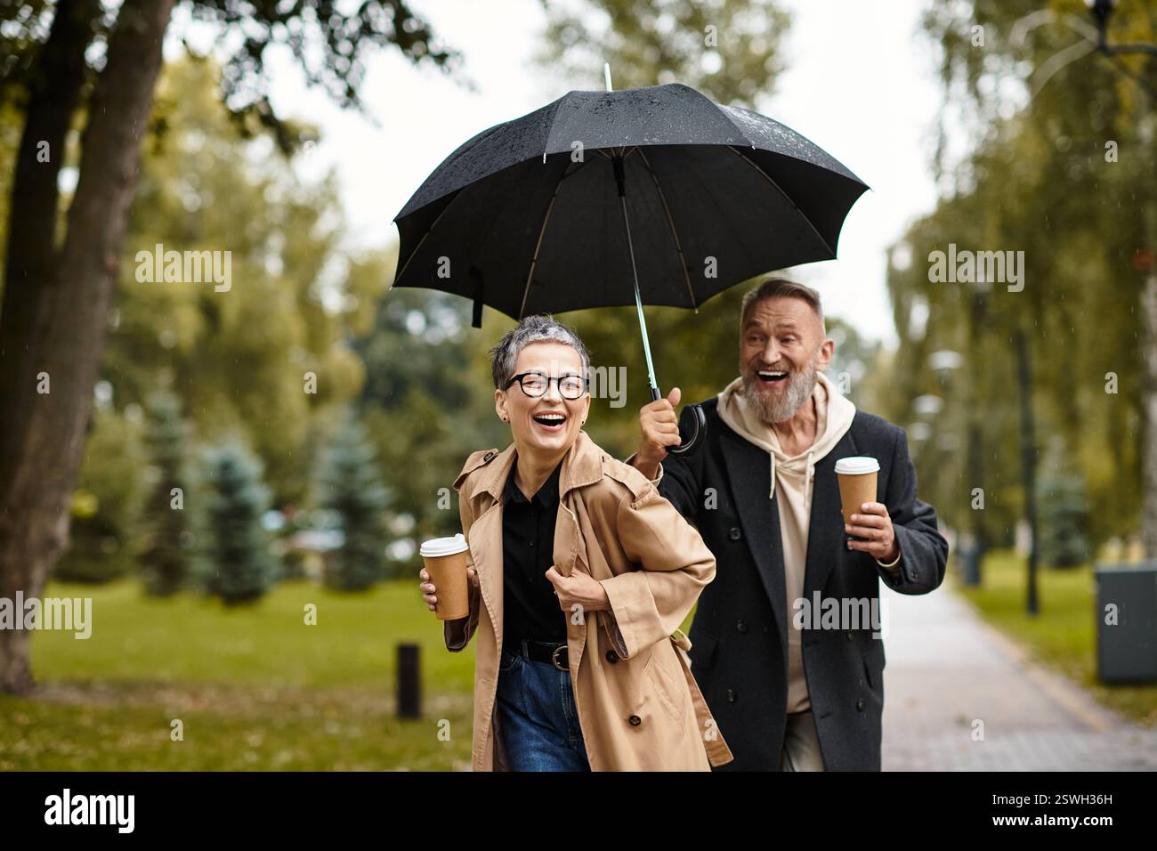A charming mature couple enjoys each others company while playfully ...