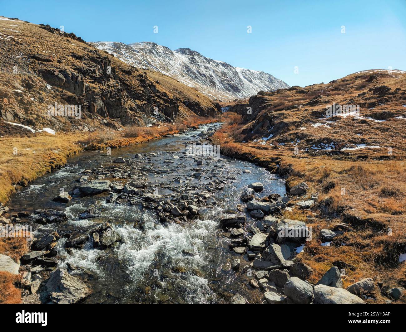 Power mountain river flows down from the glacier. Beautiful alpine ...